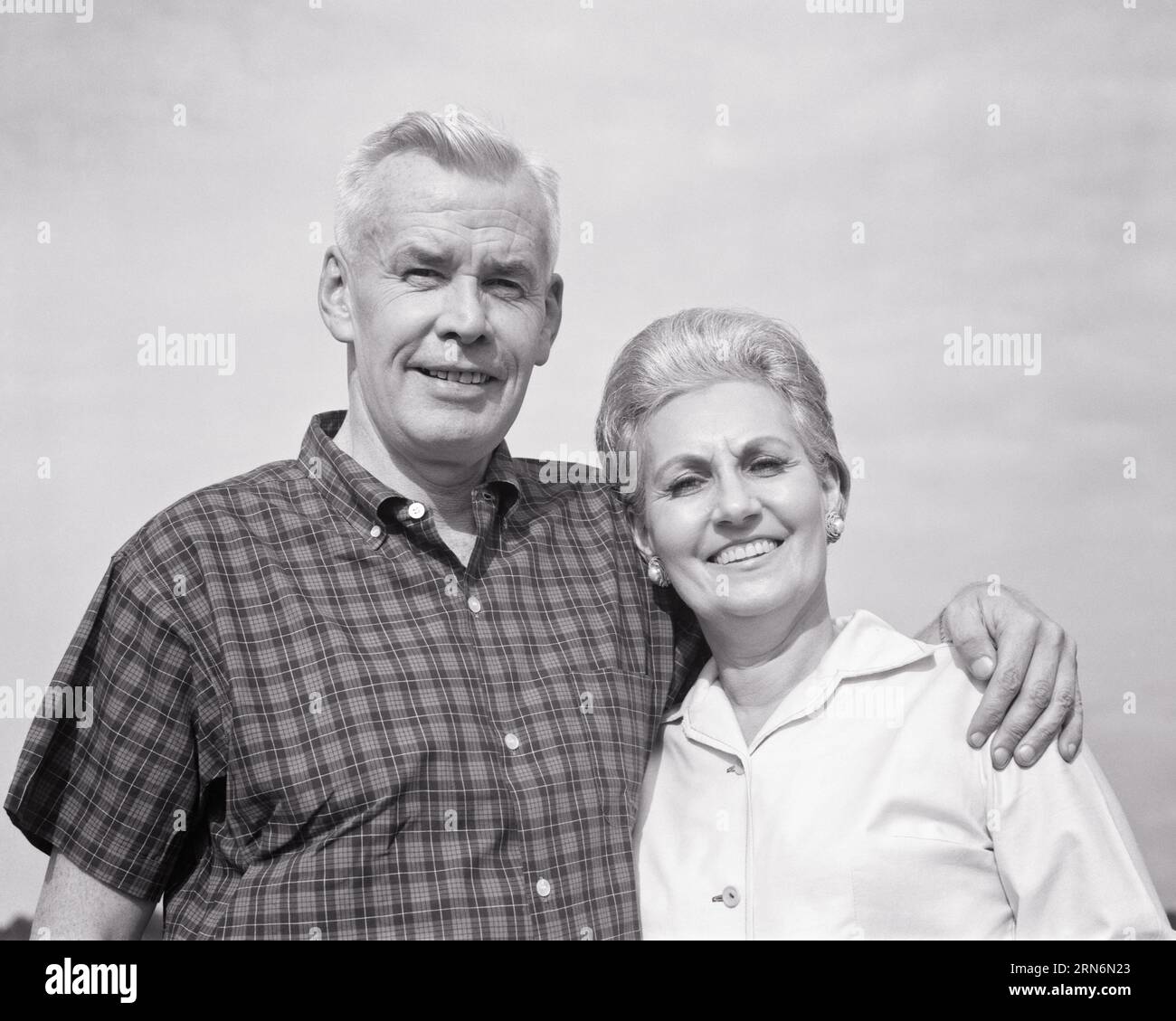 1960s PORTRAIT OF RETIRED SENIOR COUPLE MAN IN PLAID CASUAL SHIRT WITH ...