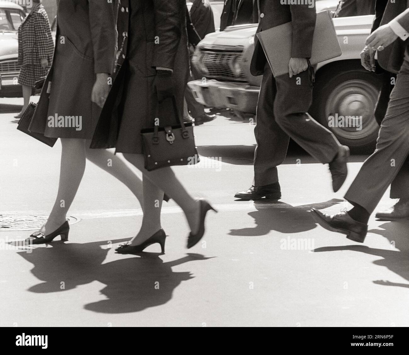 1960s 1970s DETAILS AND SHADOWS OF PEDESTRIAN FEET CROSSING A CITY ...