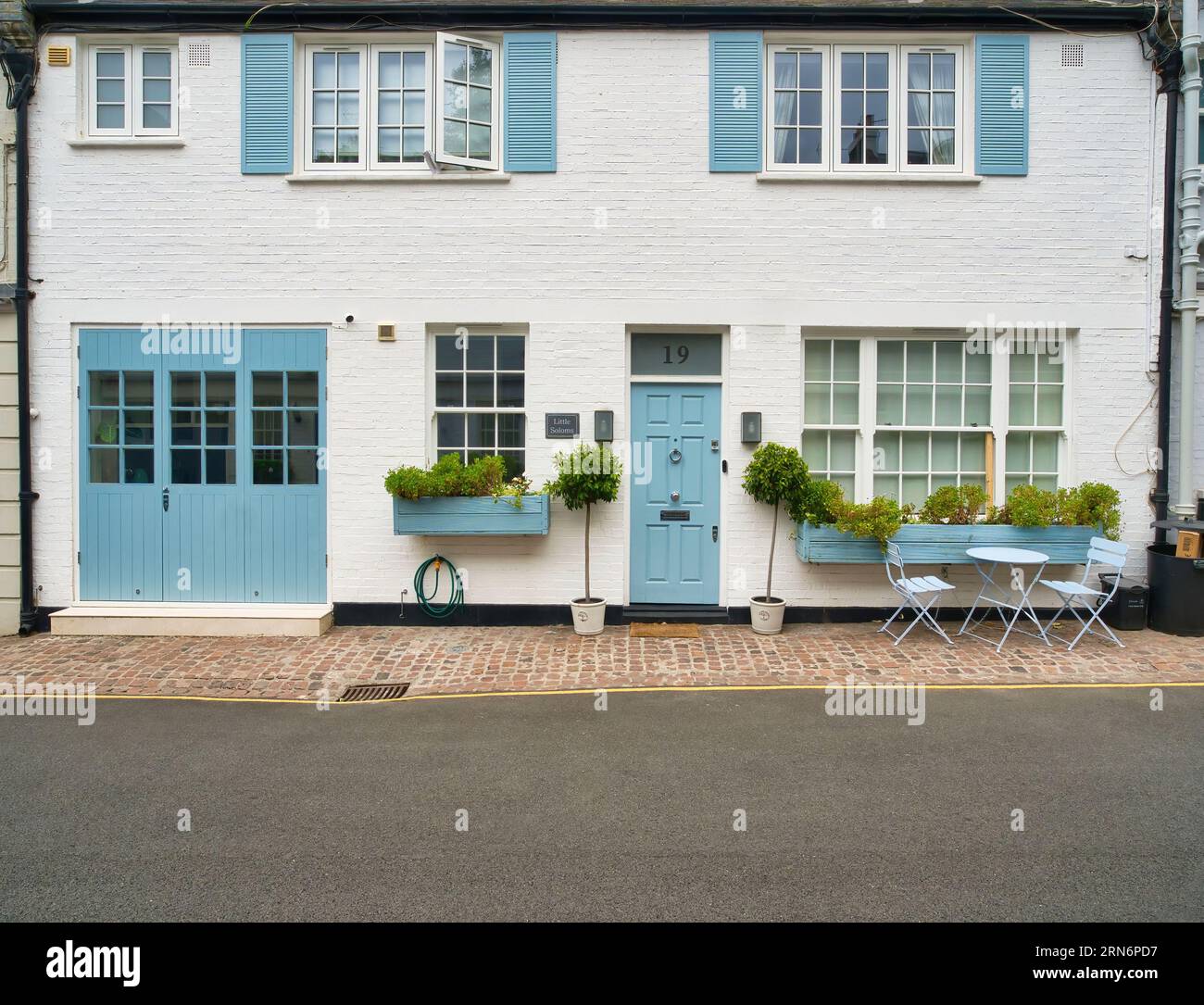 A small Mews House in Kensington with french Windows Stock Photo - Alamy