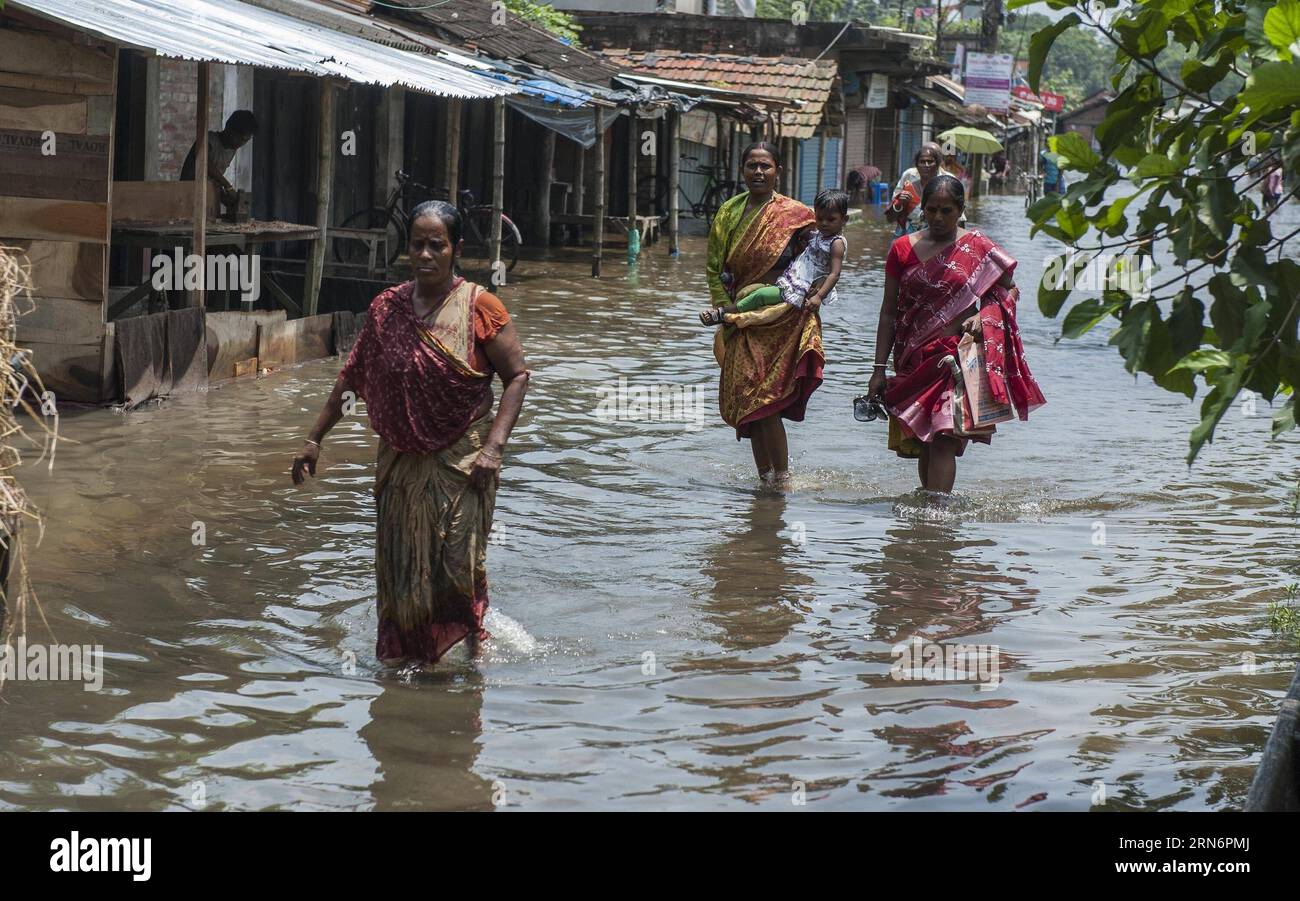 People walk through flooded street hi-res stock photography and images ...