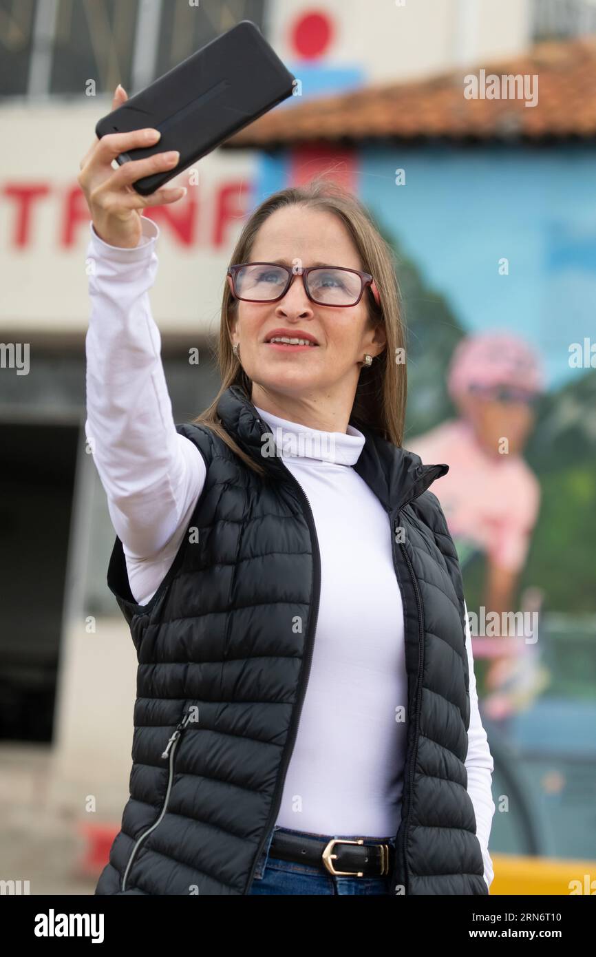 COMBITA, COLOMBIA - AUGUST 2023. Female tourist taking a selfie at the ...