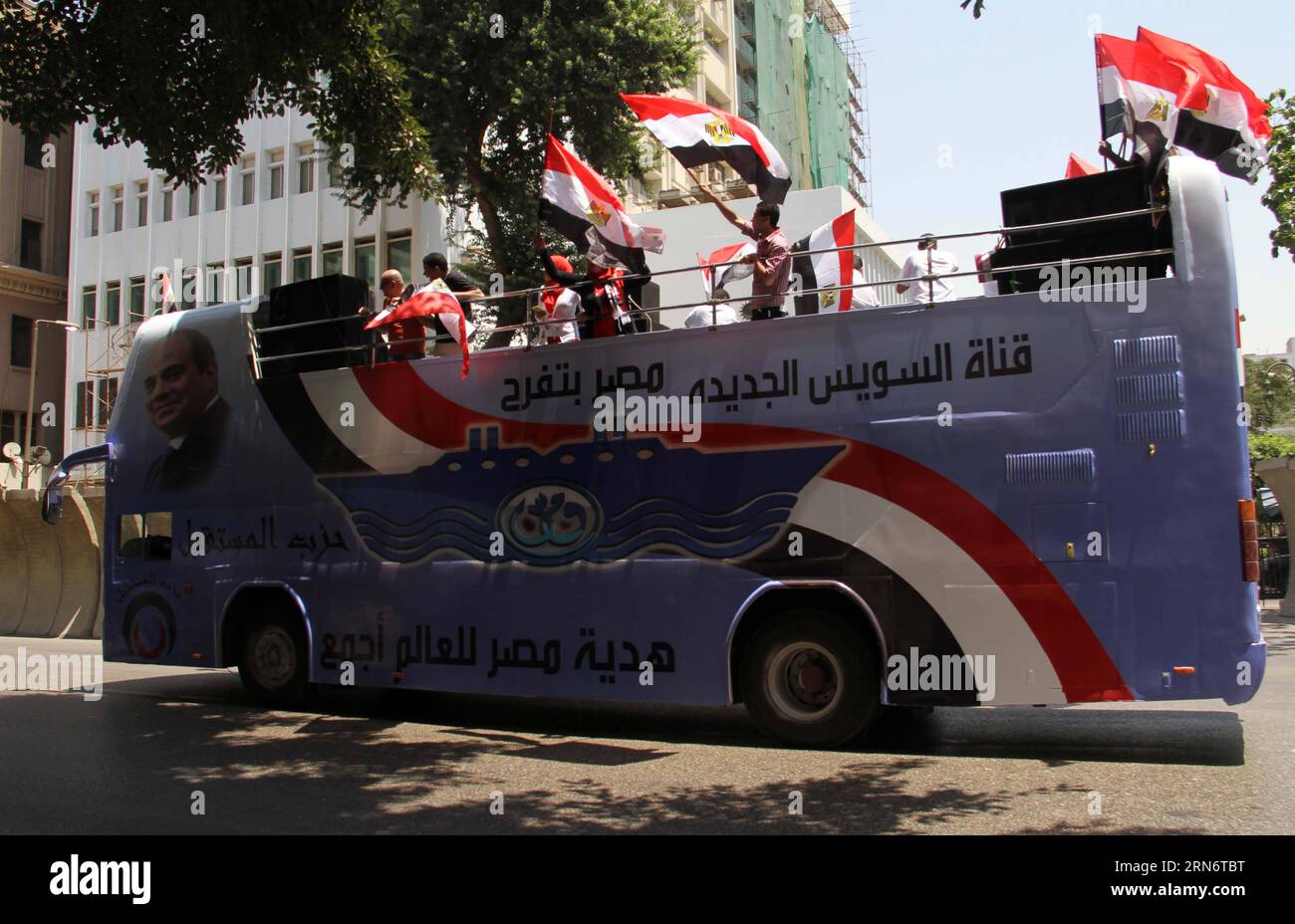 CAIRO , Aug. 6, 2015 -- Egyptians wave their national flags on a bus ...