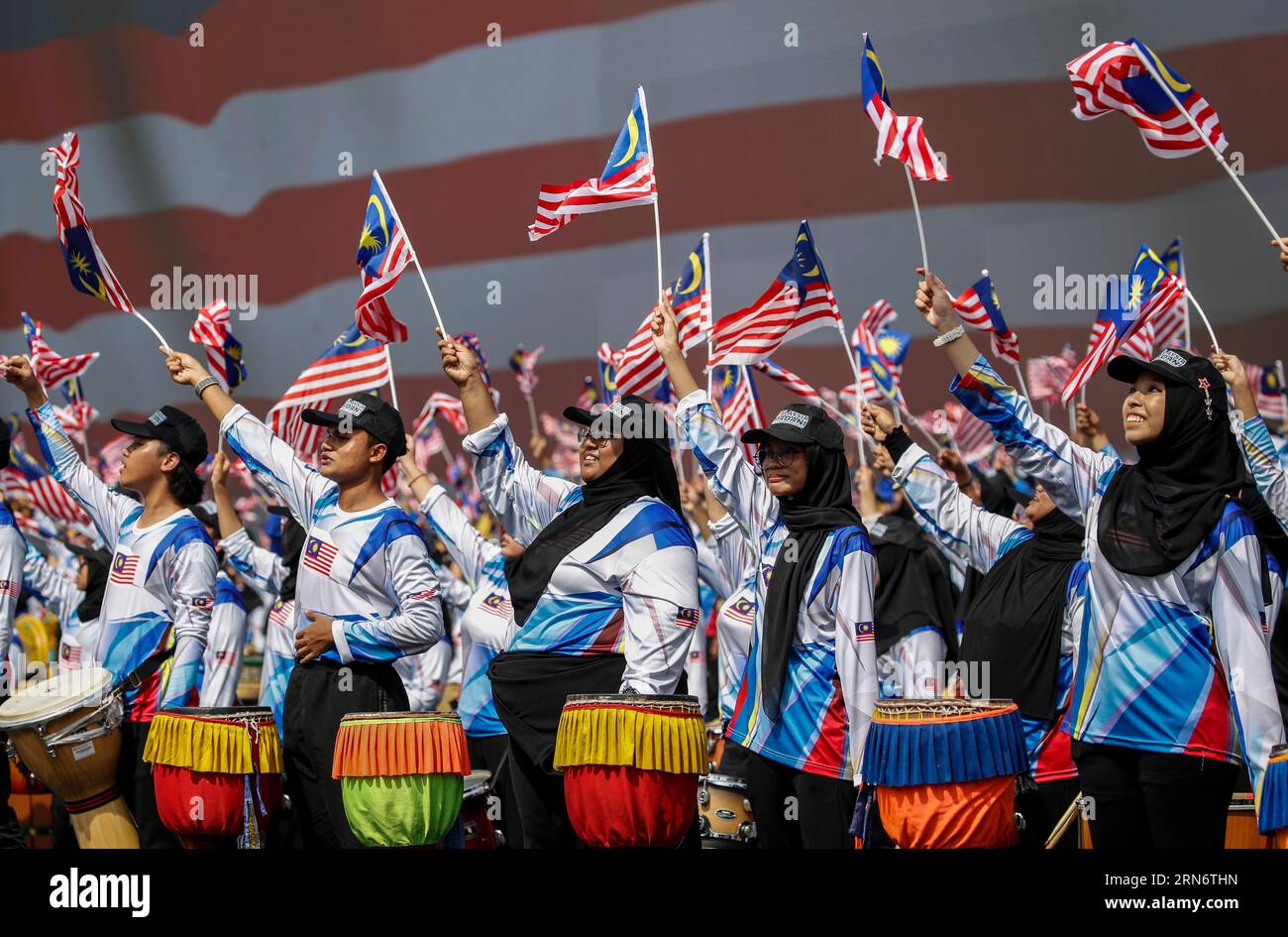 Kuala Lumpur, Malaysia. 31st Aug, 2023. Malaysian students wave ...