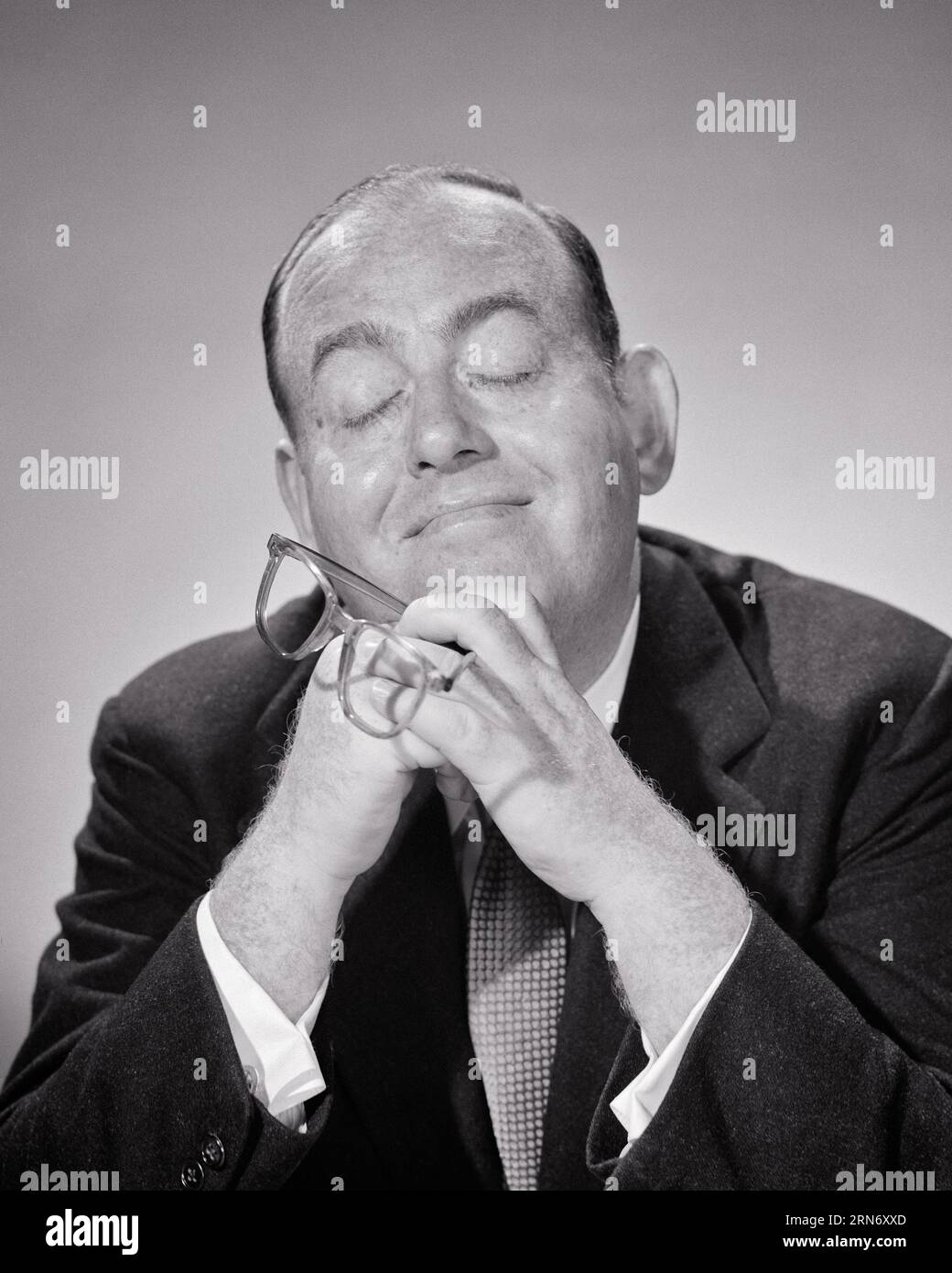 1950s SMILING BUSINESSMAN EYES CLOSED NAPPING SMILING THINKING HAPPY ...