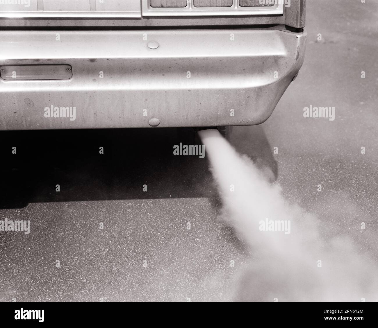 1960s REAR AUTOMOBILE BUMPER WITH EXHAUST PIPE SPEWING CARBON MONOXIDE ...