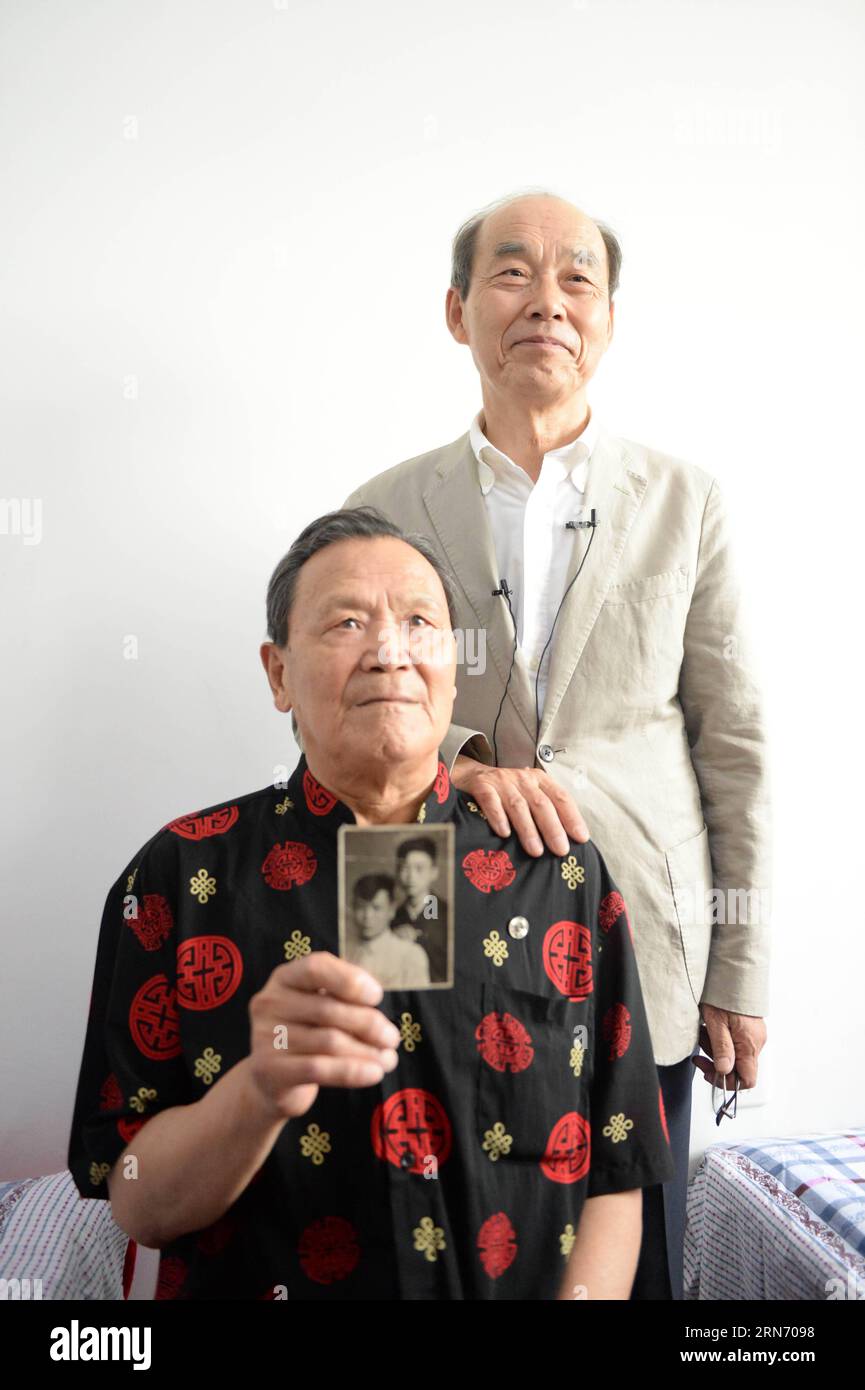 MUDANJIANG, Aug. 11, 2015 -- 73-year-old Japanese Yohachi Nakajima (R ...