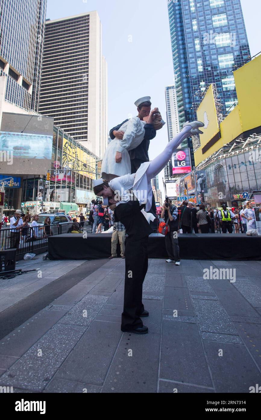 Two performers dance during the Times Square Kiss-in event in New York ...