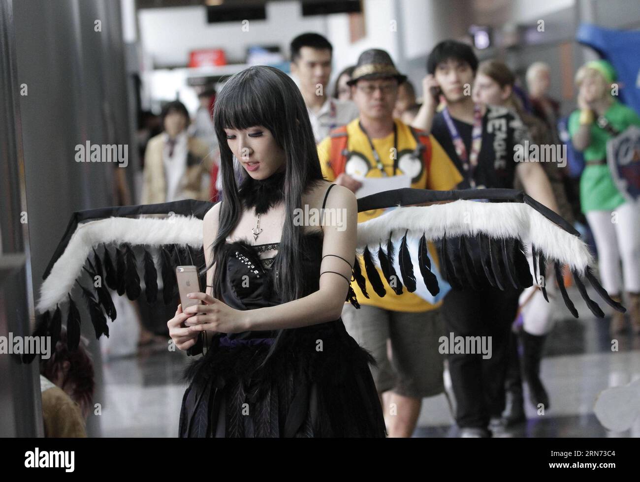 A cosplayer makes a selfie during the Anime Revolution event at ...