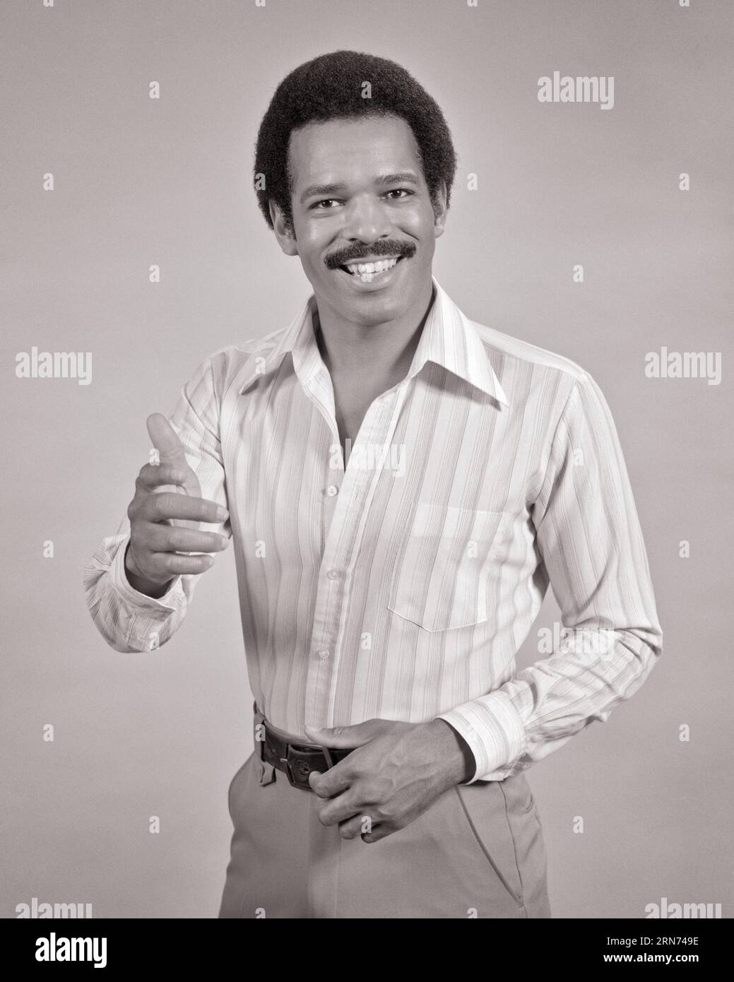 1970s AFRICAN-AMERICAN MAN WITH MUSTACHE SMILING GIVING THUMBS UP ...