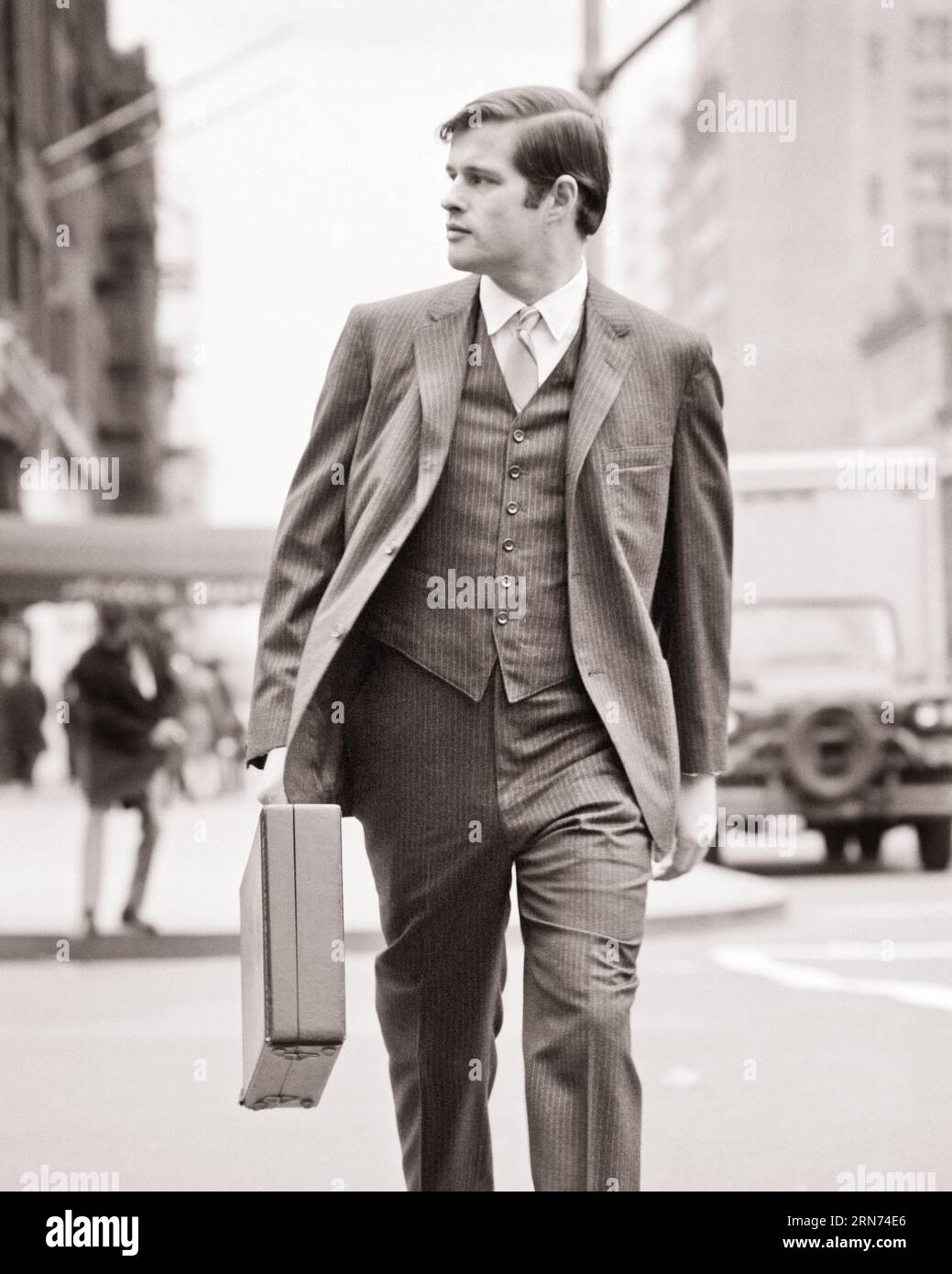 1970s SERIOUS BUSINESS MAN WALKING TO WORK WEARING THREE PIECE SUIT ...