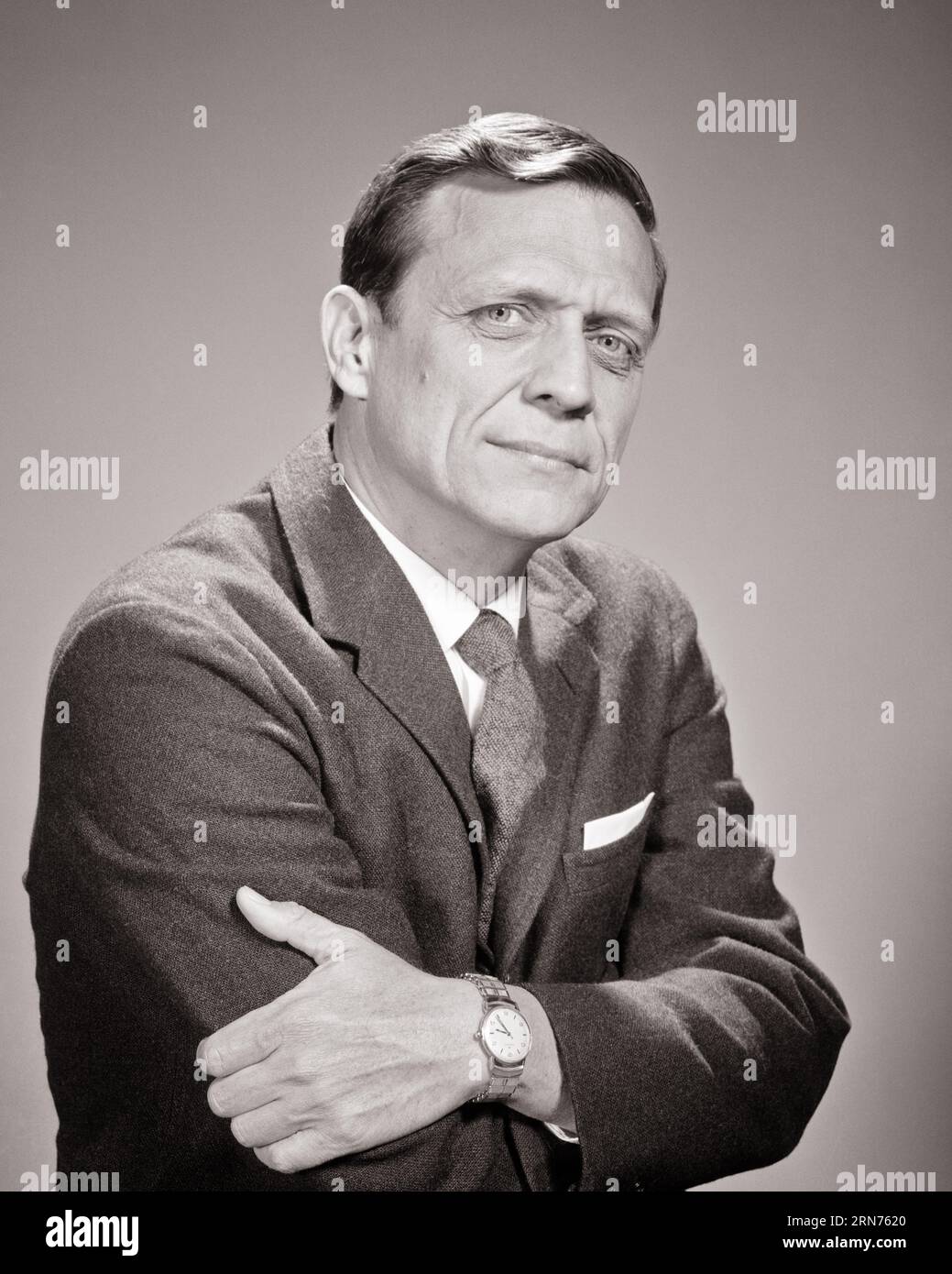 1960s PORTRAIT OF MIDDLE-AGED BUSINESSMAN WEARING SUIT TIE WRISTWATCH ...