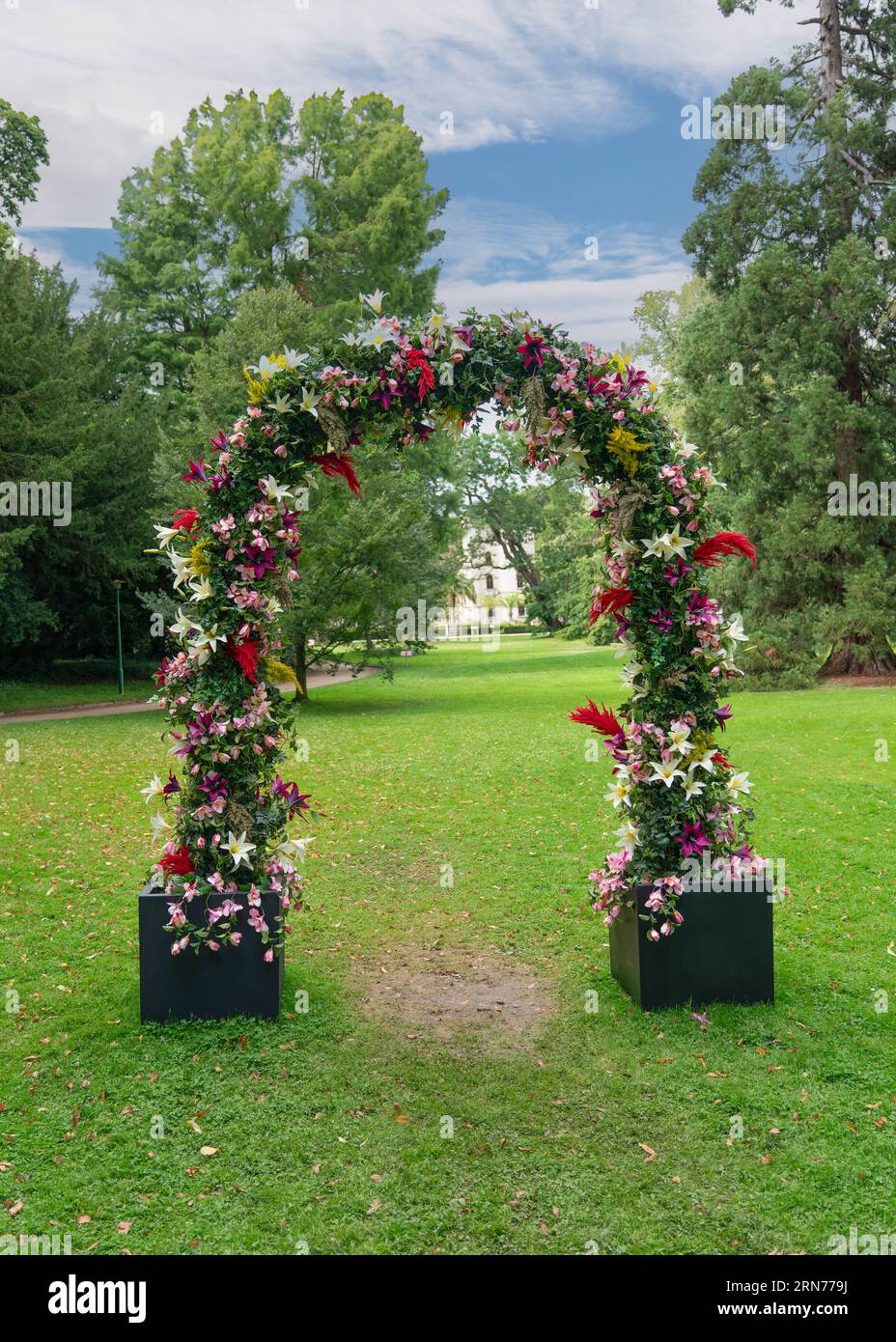 Floral wedding arch on green grass in National Botanic Garden of ...