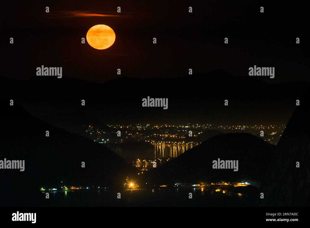 -- RIO DE JANEIRO, - The moon rises over the Guanabara Bay in Rio de ...