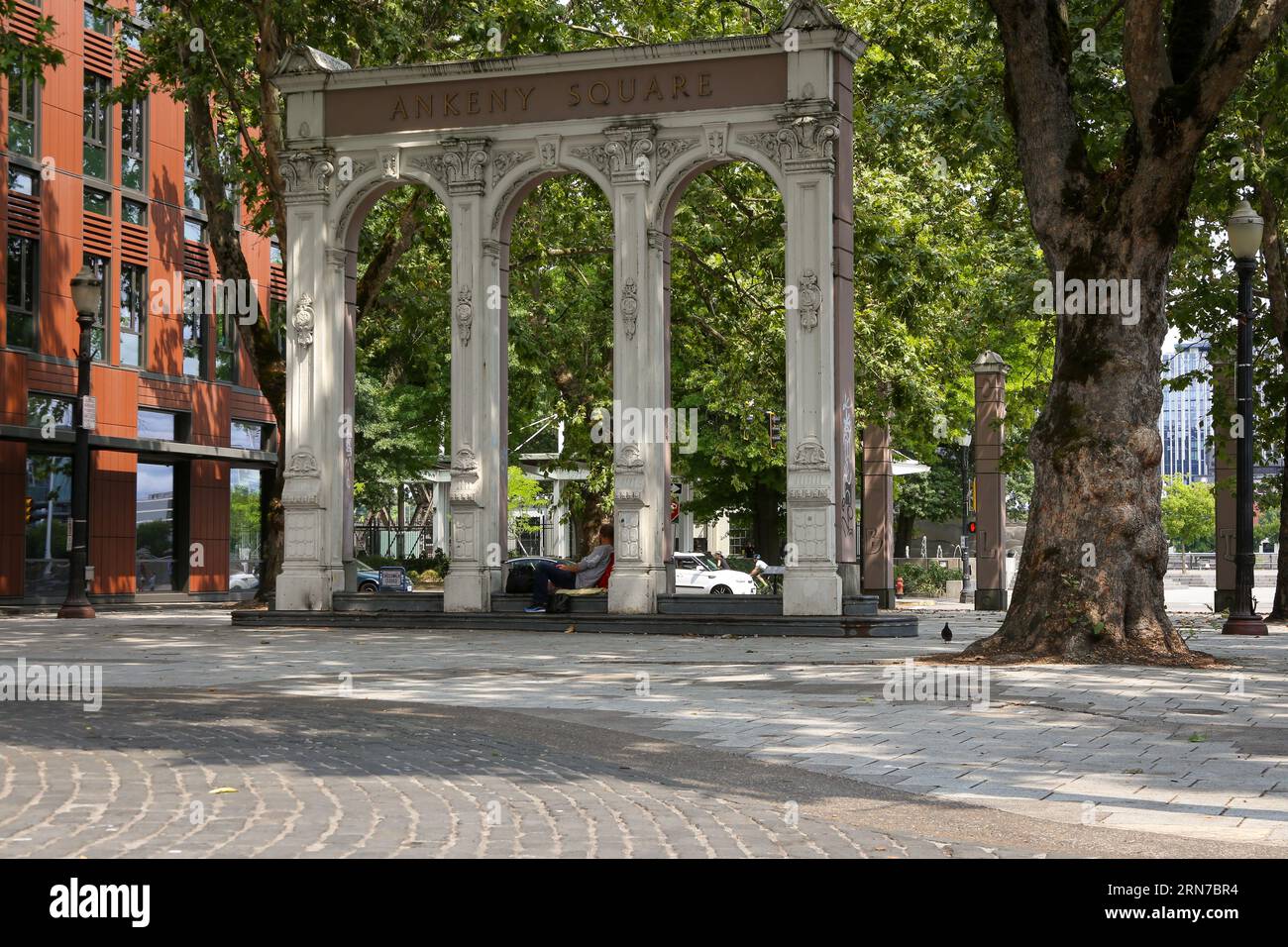 Young homeless person resting in the entrance to Ankeny Square in ...