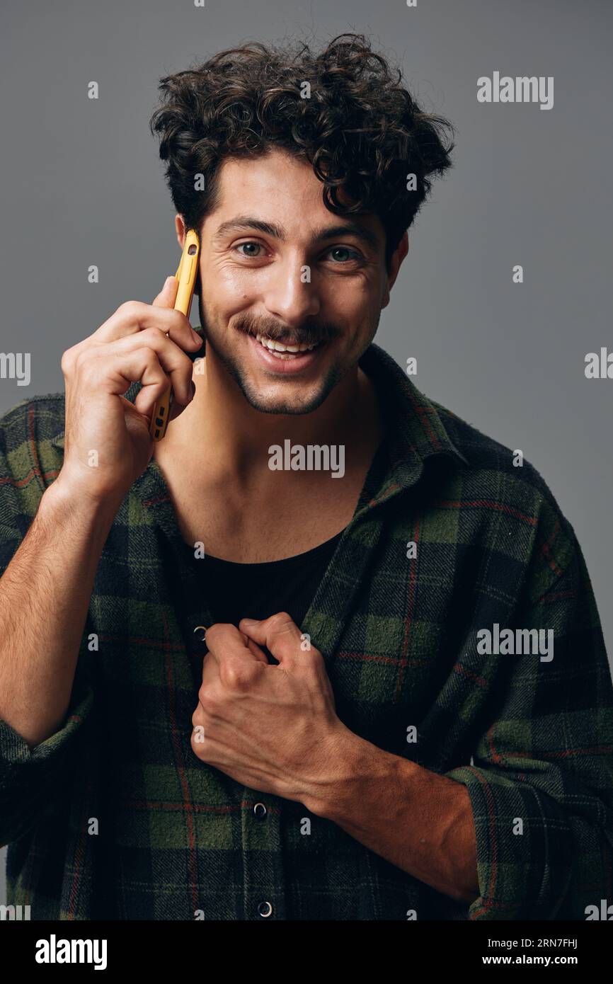 Lifestyle man studio background phone stylish grey happy Stock Photo ...