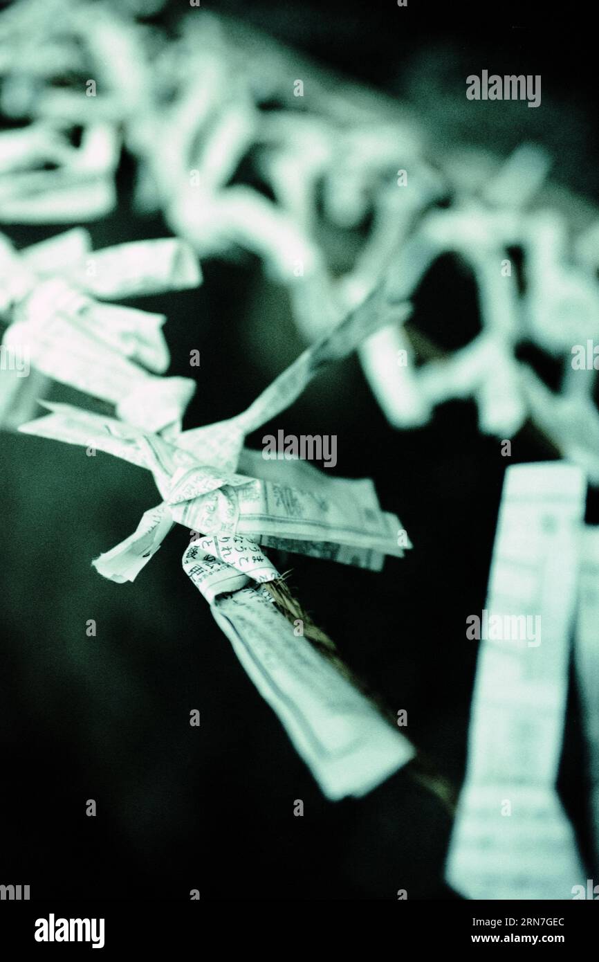 Wishing well cards and folded messages in a temple in Kyoto Stock Photo ...