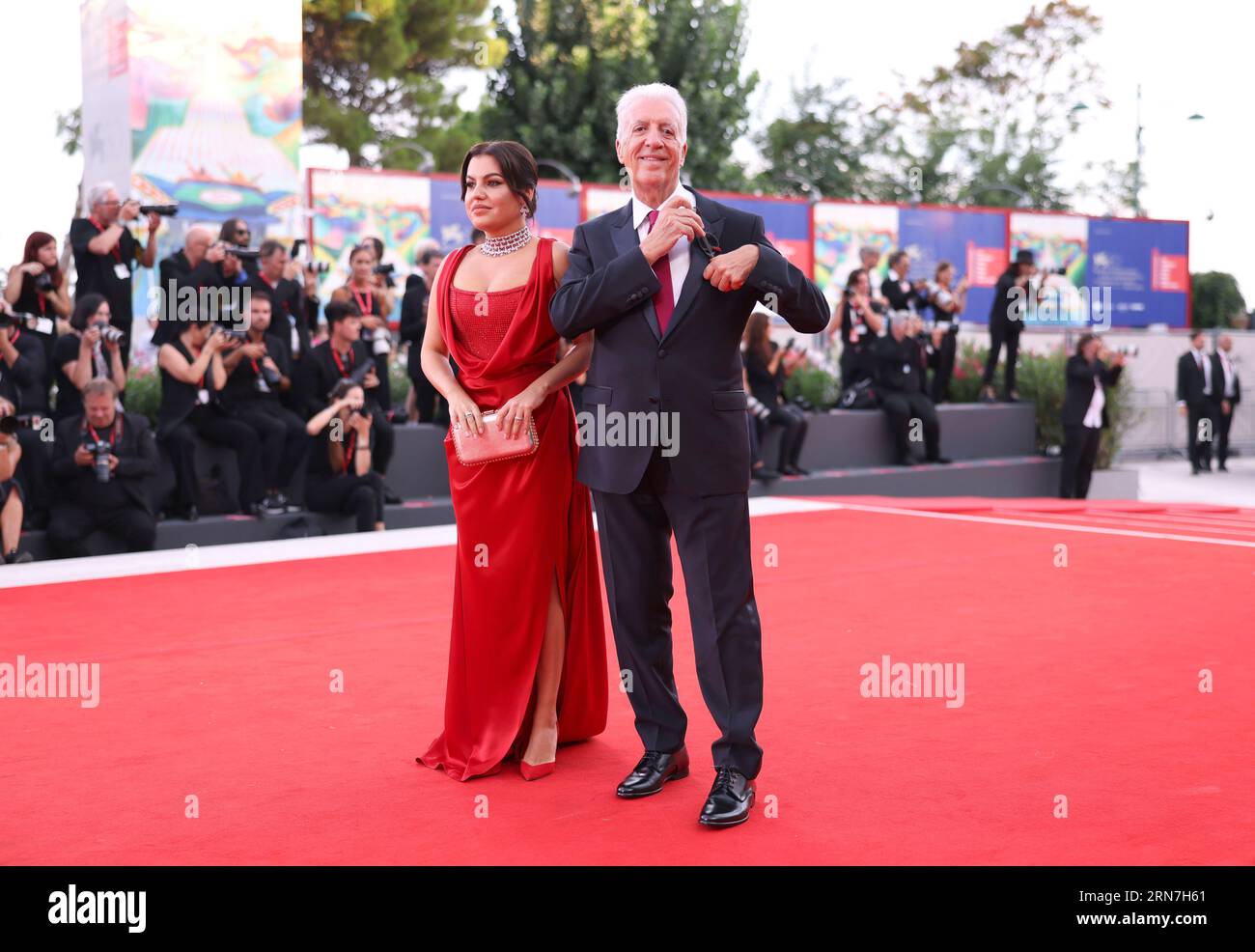 Romina Gingasu, left, and Piero Ferrari pose for photographers upon ...