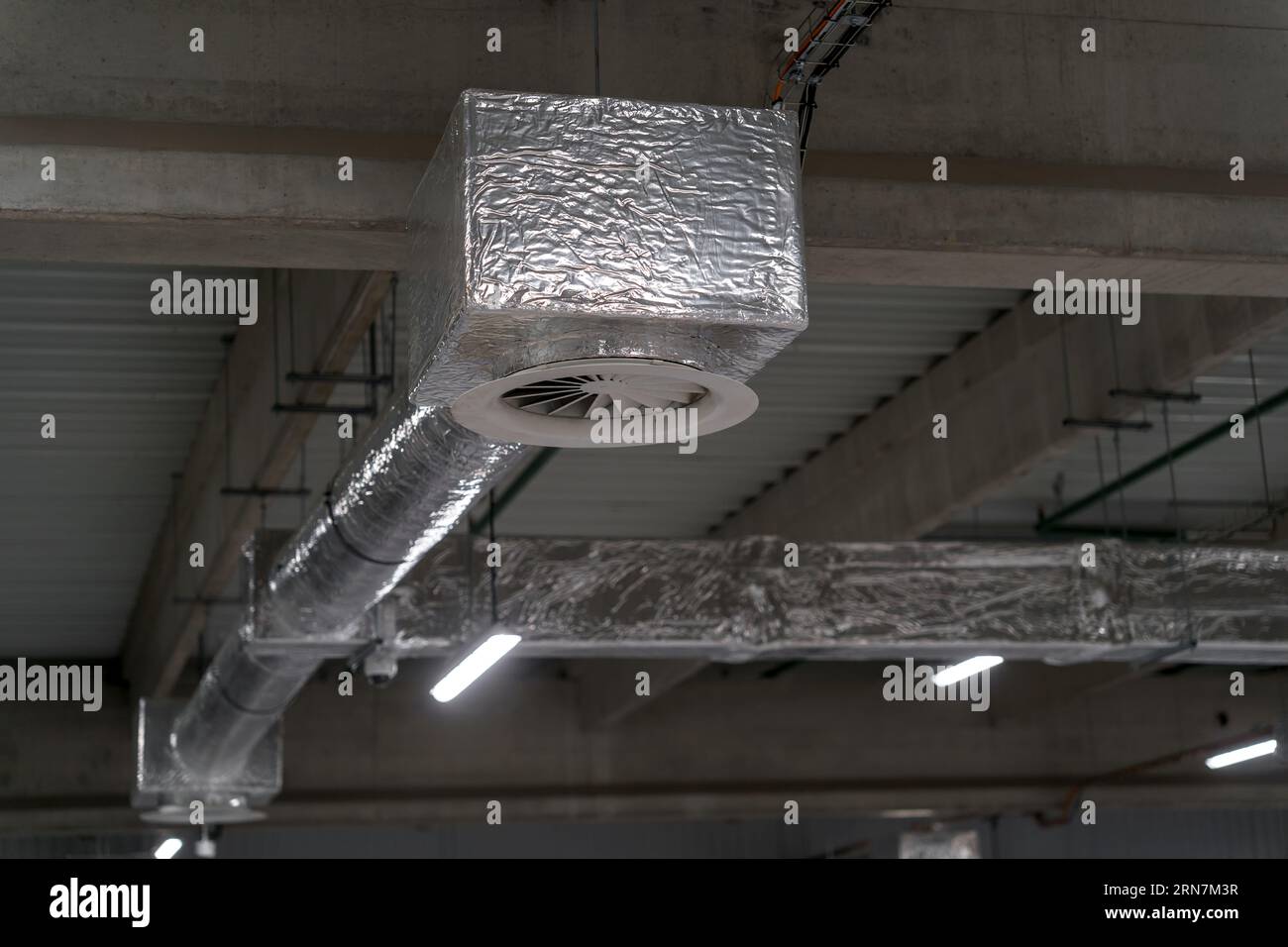 Air ventilation system on the ceiling in a large warehouse Stock Photo ...