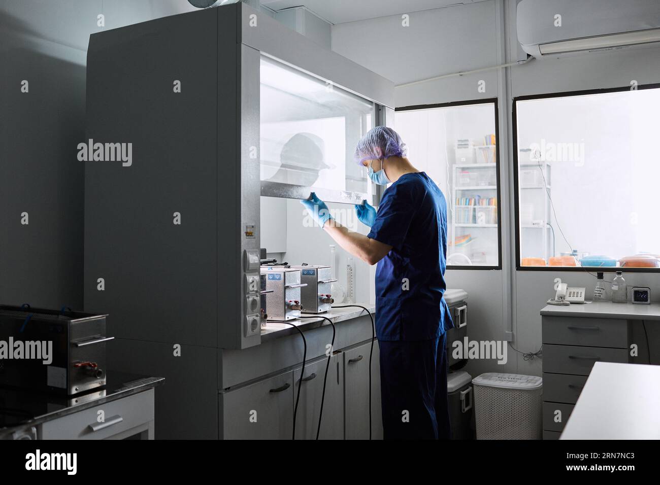 Scientists work in the laboratory. A researcher conducts laboratory ...