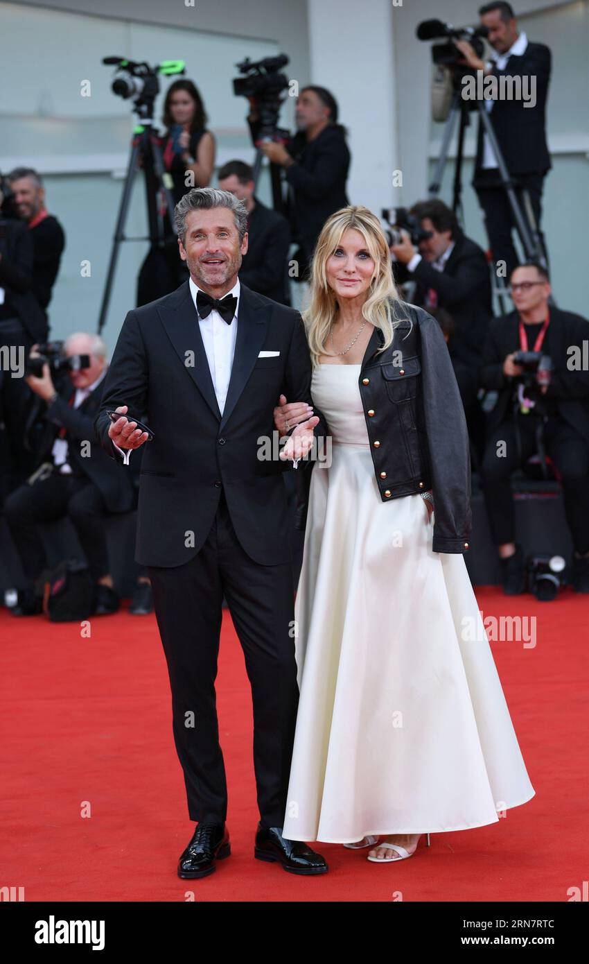 Venice, Italy. 31st Aug, 2023. Actor Patrick Dempsey and his wife pose ...