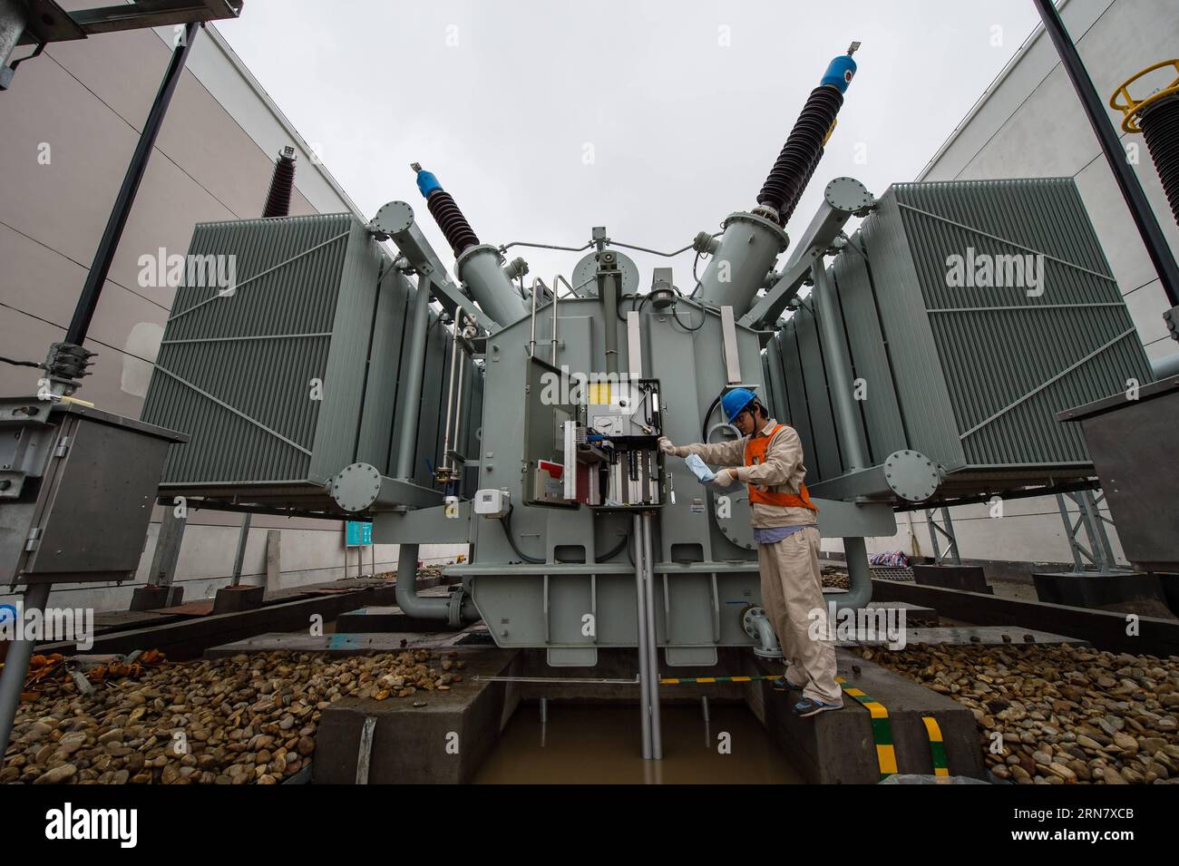 NANTONG, Sept. 23, 2015 -- Technicians examine a control box at an ...