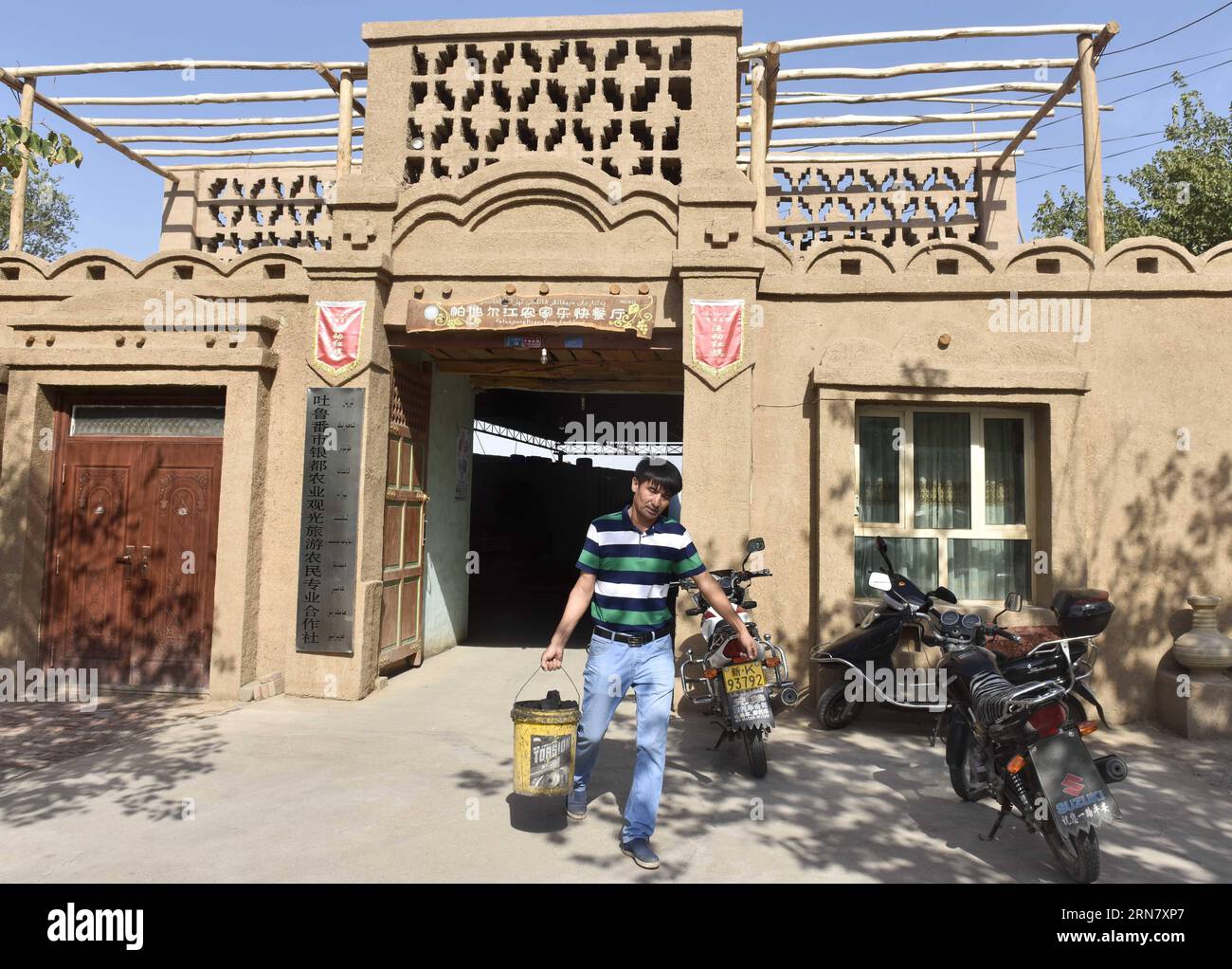 Pataer Keyimu walks out of his home in the Grape Valley of Turpan ...