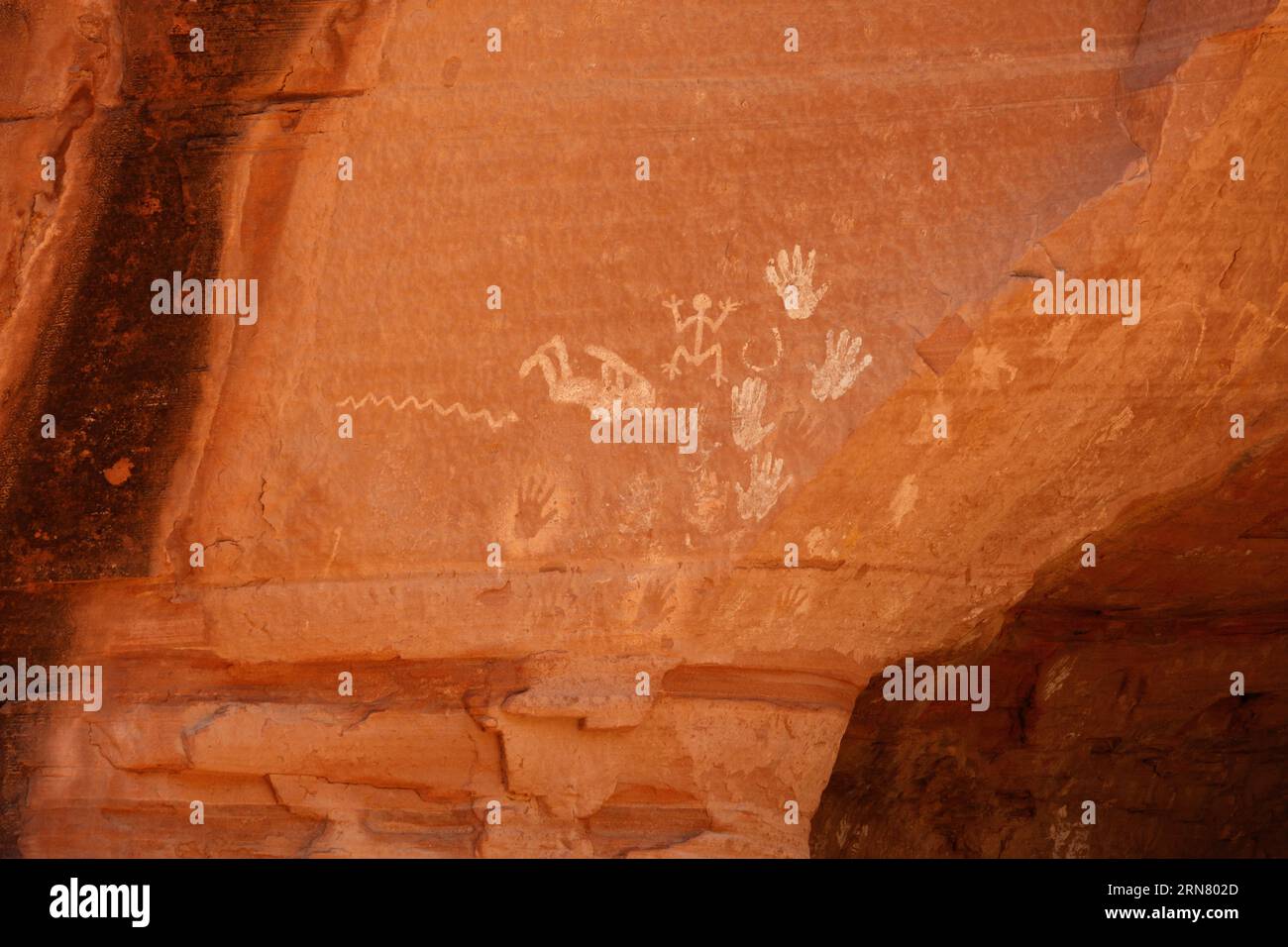 Anasazi Petroglyphs with hand prints and kokopelli figure in Canyon De ...