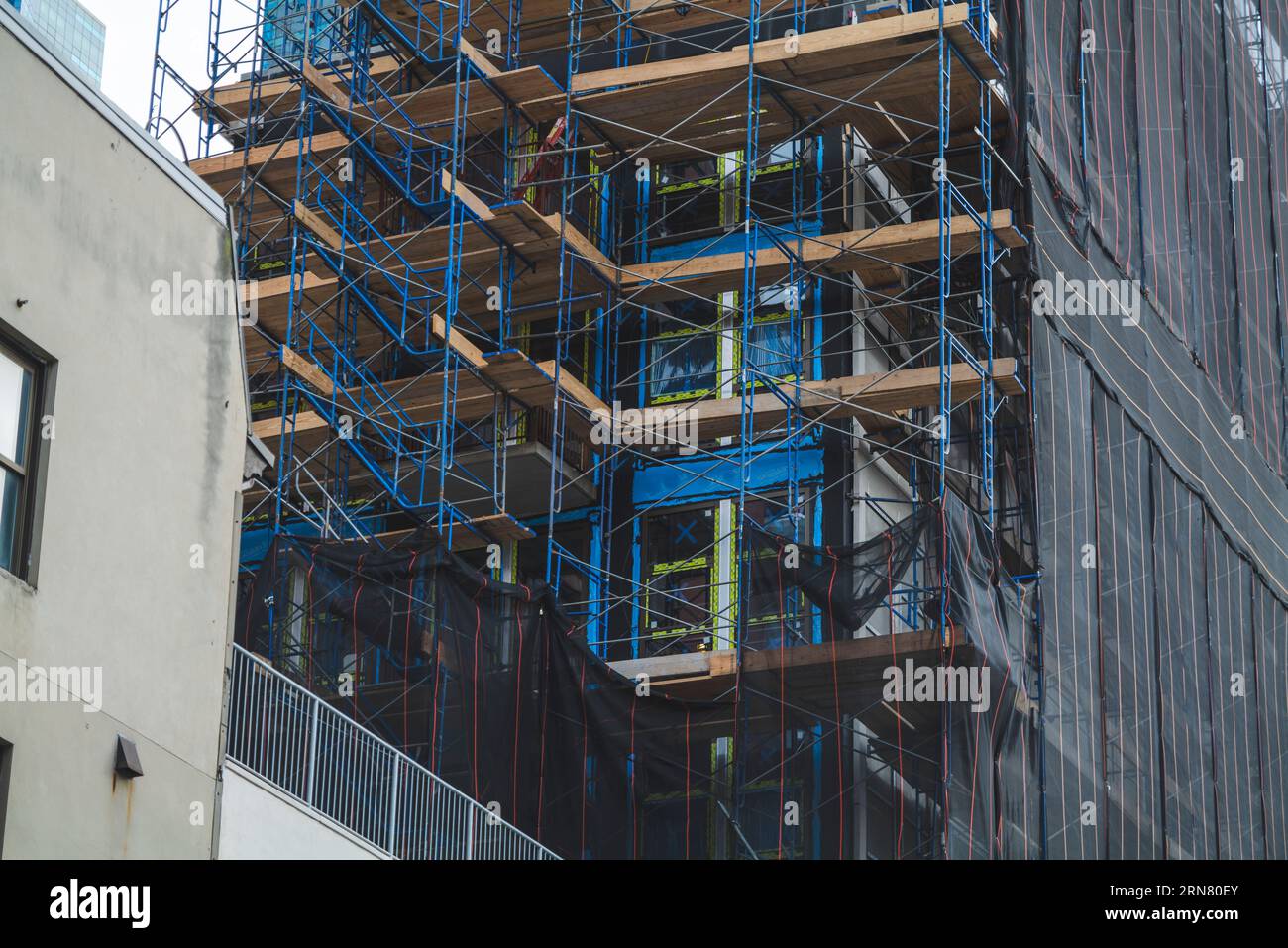 construction site building under construction: concrete and wood ...