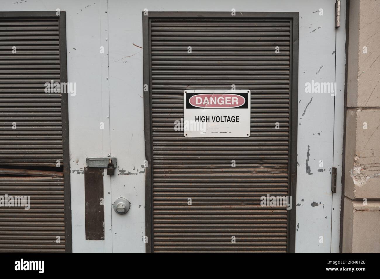 Transformer metal door with High voltage sign Stock Photo - Alamy