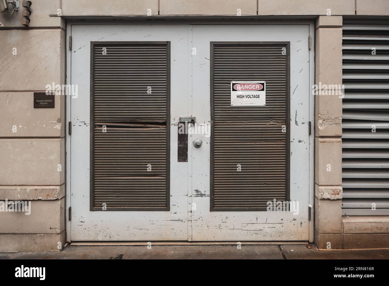 Transformer metal door with High voltage sign Stock Photo - Alamy