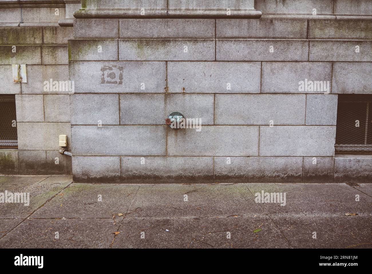 Fire hydrant water pipe, mounted in a building wall. Manhattan USA ...