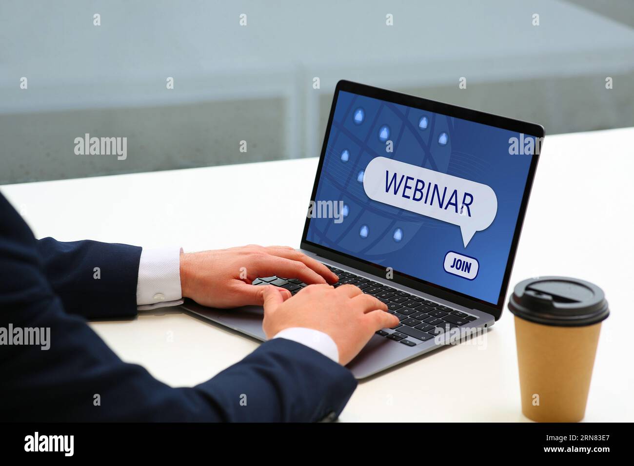 Online webinar, web page on computer screen. Man using laptop at white ...
