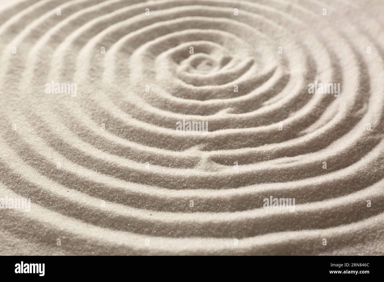 Beautiful spiral on sand, closeup. Zen garden Stock Photo - Alamy