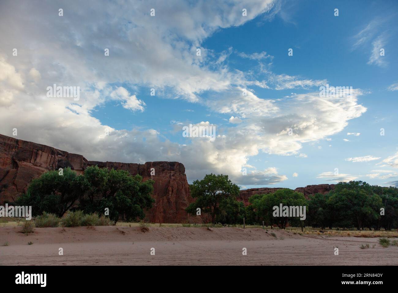 Landscape with rainbow as seen from the bottom of Canyon De Chelly ...