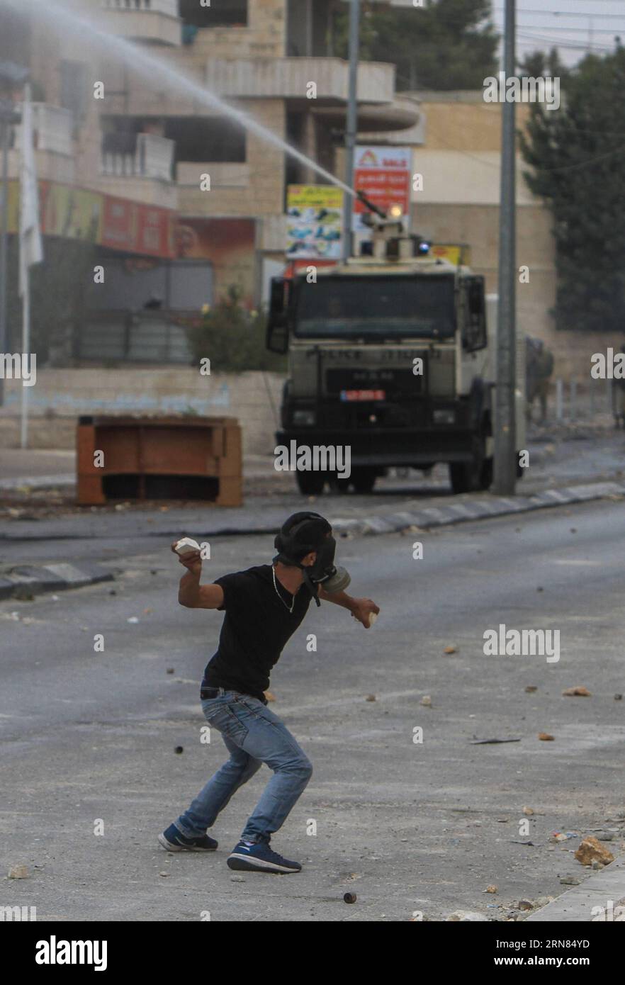 (151006) -- BETHLEHEM, Oct. 6, 2015 -- A Palestinian protester hurls ...
