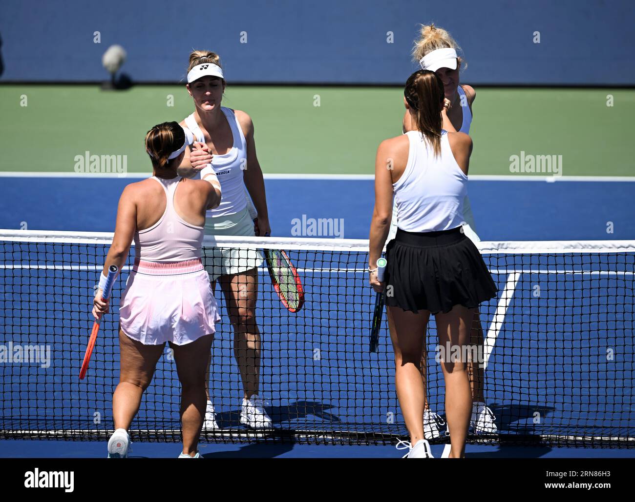 Gabriela Dabrowski and Erin Routliffe shake hands with Lauren Davis and ...