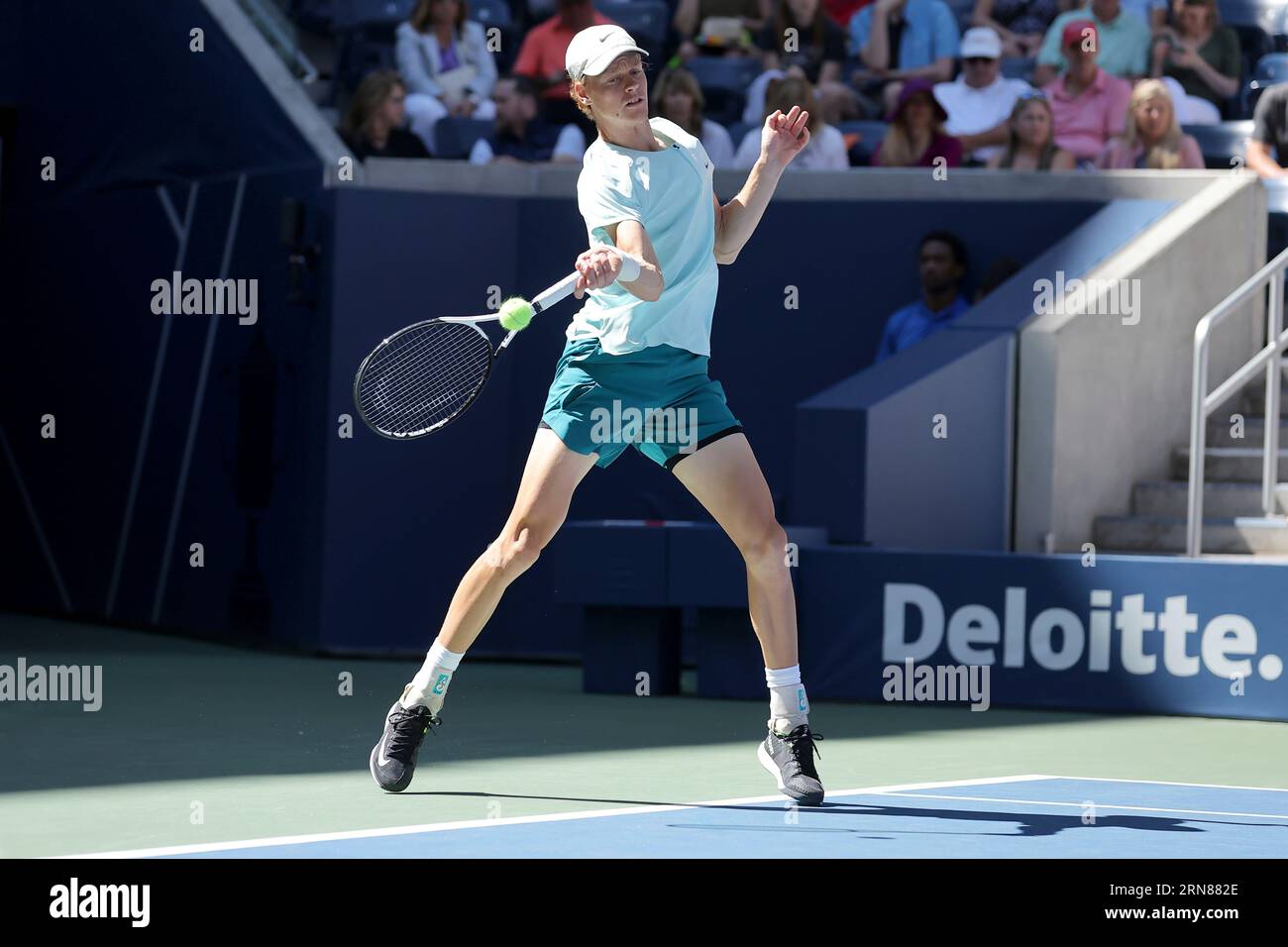 Jannik Sinner in action during a men's singles match at the 2023 US ...