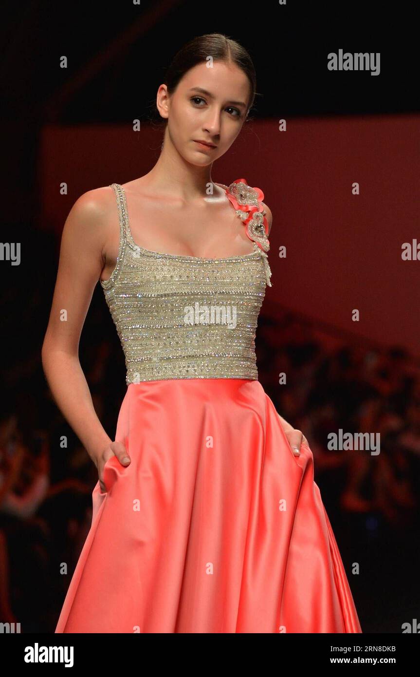 SHANGHAI, Oct. 18, 2015 -- A model presents a wedding dress creation by ...