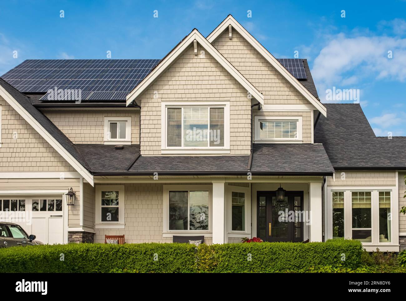 Solar panels on a house roof. Beautiful large modern house and solar ...