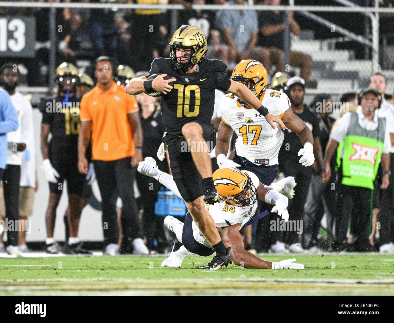 August 31, 2023: UCF quarterback John Rhys Plumlee (10) avoids the ...