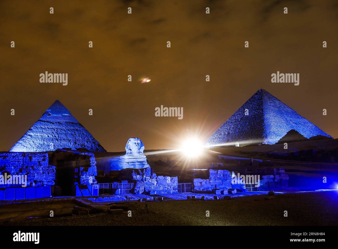 The Great Pyramids of Giza is lit up blue in Giza, Egypt, as part of ...