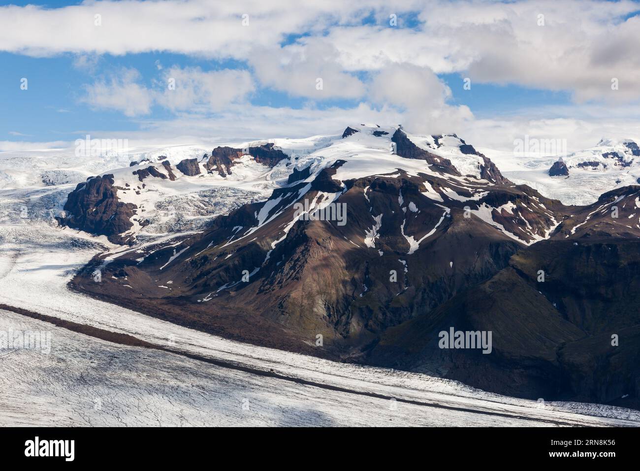 Skaftafellsjokull glacial river flowing down a volcano mountain in ...