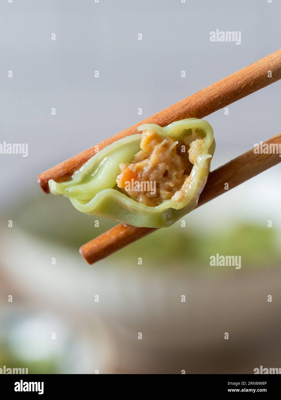 Chopsticks holding a dumpling hi-res stock photography and images - Alamy