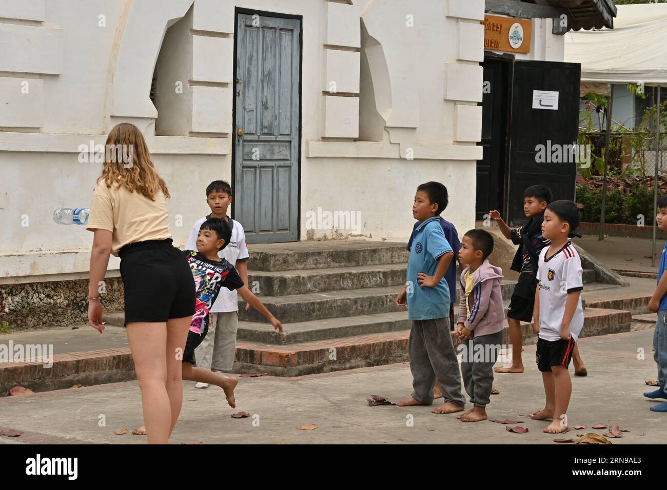 Group of laotian children playing games in the courtyard of a school ...