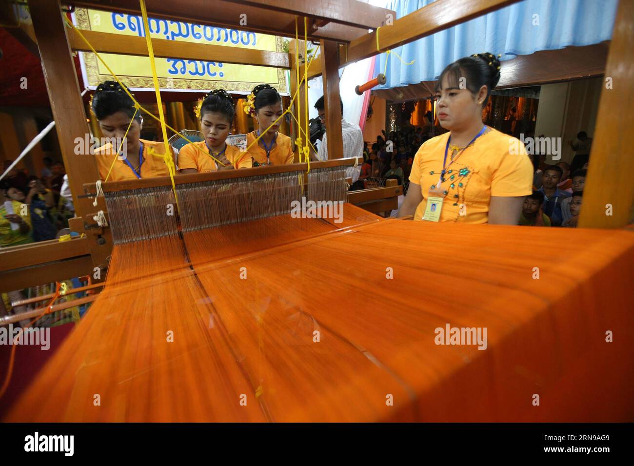 Women compete weaving robes at Shwedagon Pagoda in Yangon, Myanmar, Nov ...