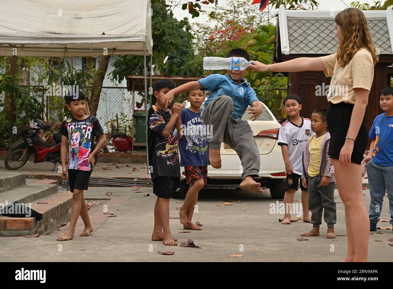 Group of laotian children playing games in the courtyard of a school ...