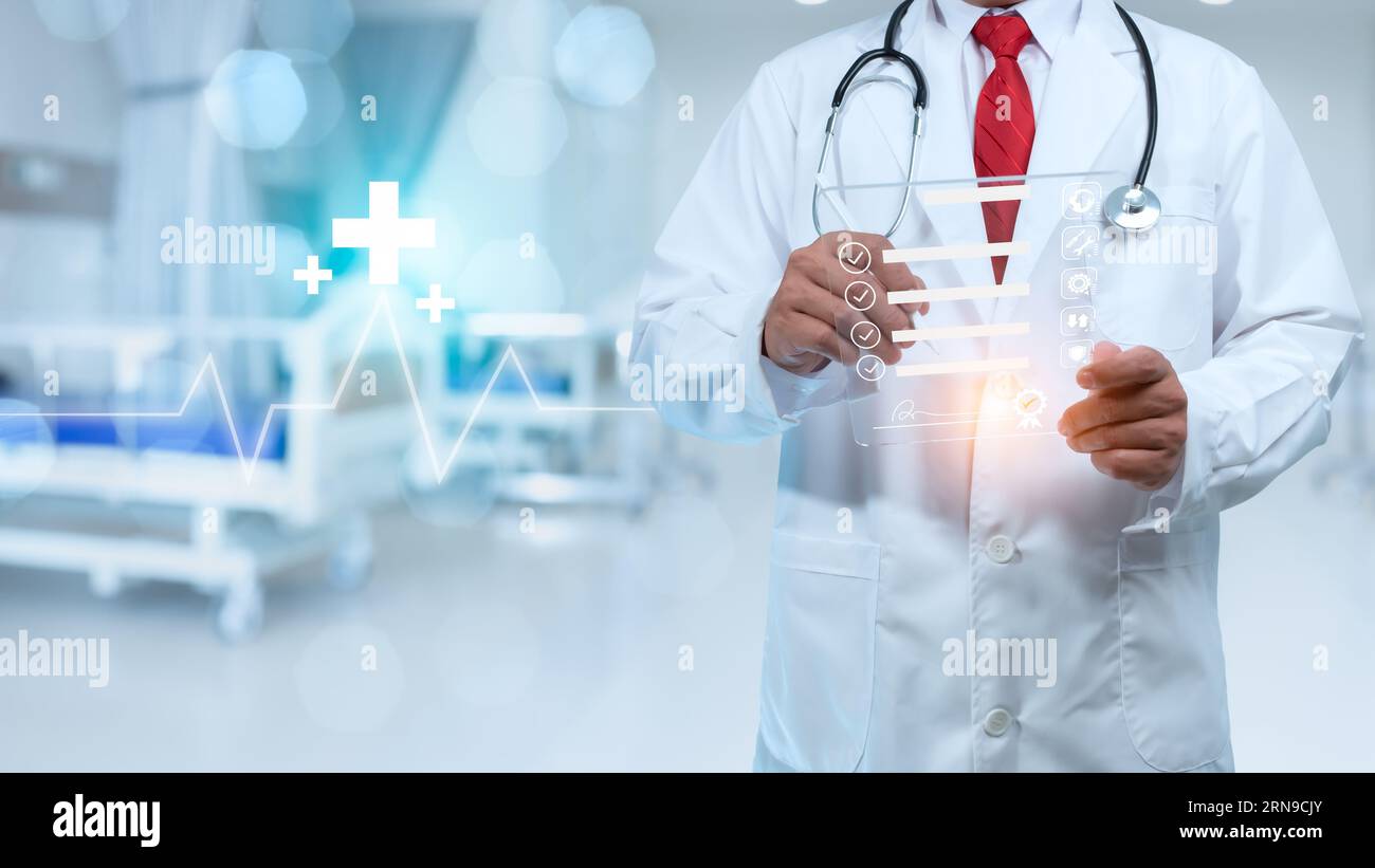 The doctor signs a document approving the patient's treatment. medical ...