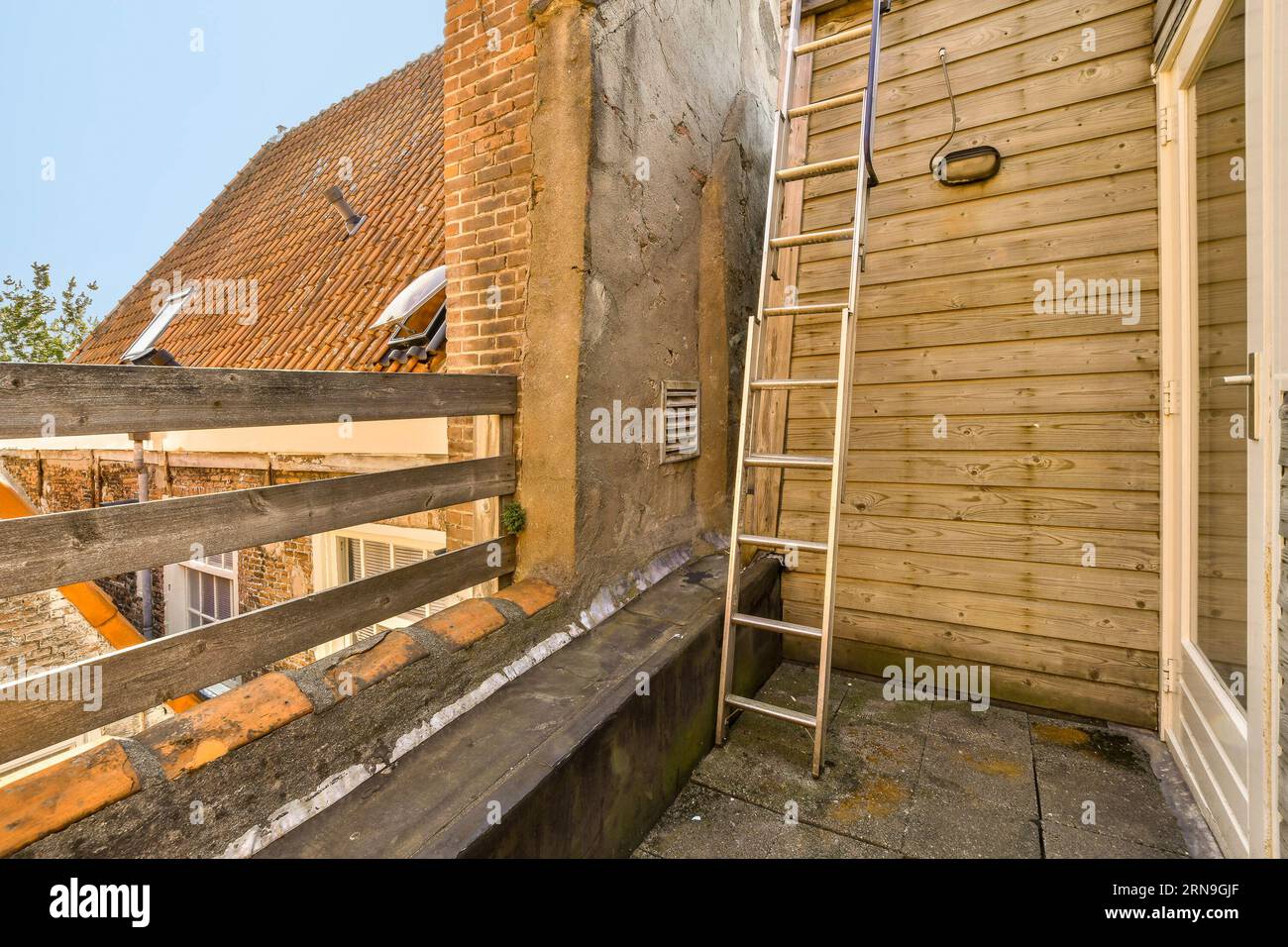 a ladder leaning on the side of a house that is being used as an ...