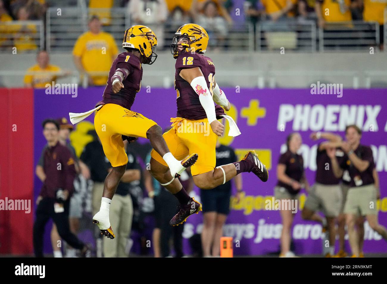 Arizona State defensive back Jordan Clark (1) and tight end Jalin ...