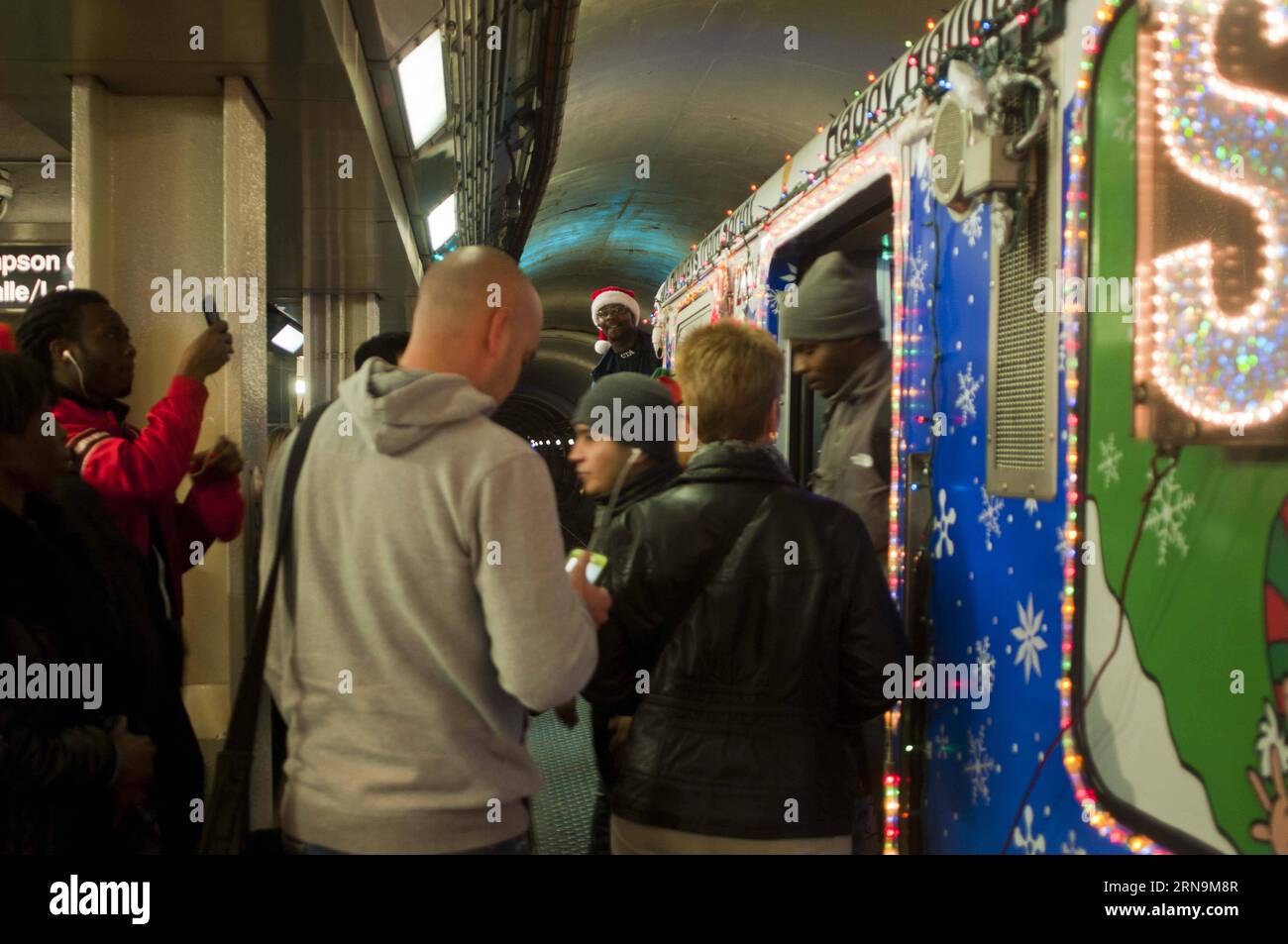 (151211) -- CHICAGO, Dec. 11, 2015 -- People board the Chicago Transit ...